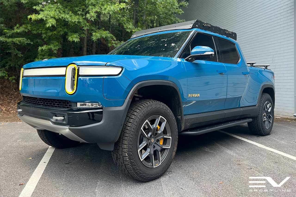 Rivian Blue Rivian R1T with Triple Square Thread Rock Sliders - EV ...